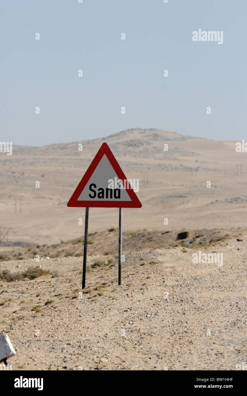 Road sign warning against sand in Namibia Stock Photo - Alamy