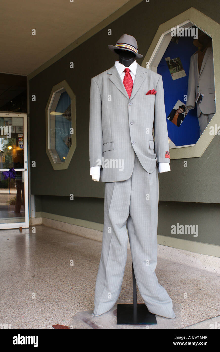 manikin with grey suit and hat on the side walk Stock Photo - Alamy