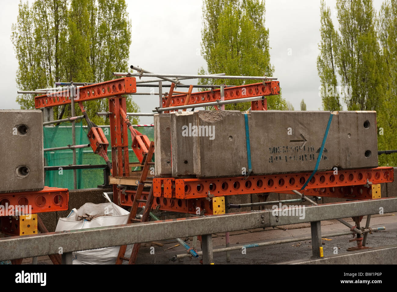 Scaffolding Concrete Counterbalance weights on bridge Stock Photo - Alamy