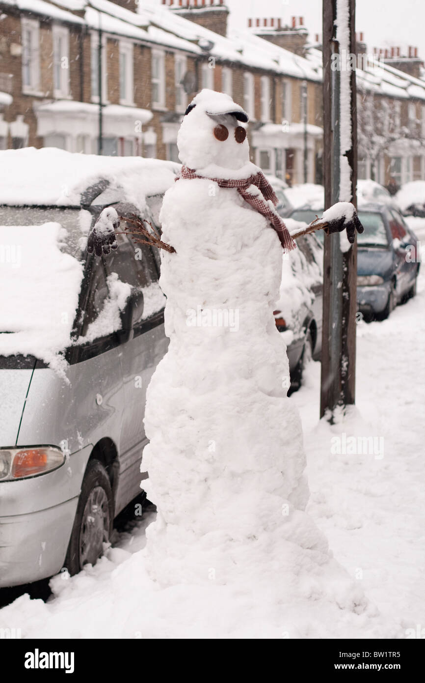 A large snowman is built out on the street after a snow falls during a ...