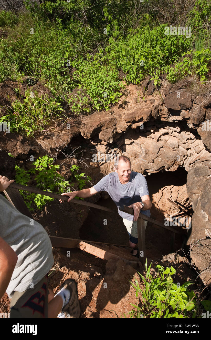 Galapagos Islands, Ecuador. Exploring a lava tube at Post Office Bay ...