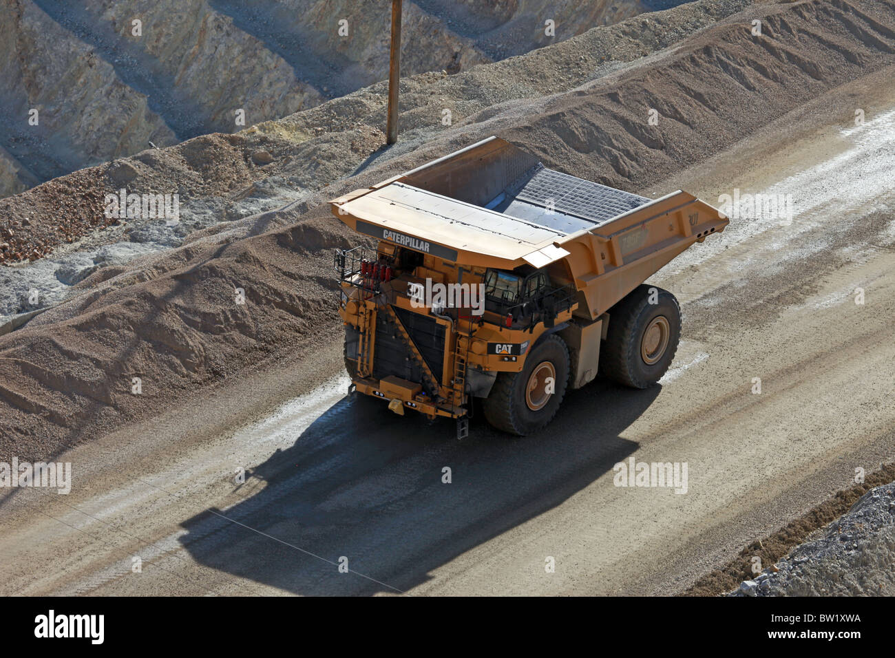 Large mine truck from overhead moving loads of ore on road. Kennecott ...