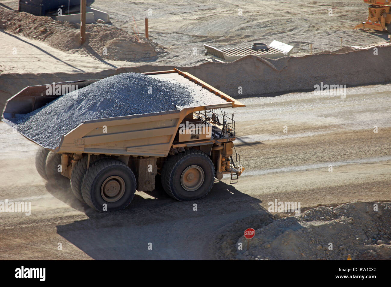 Mine truck moving loads of ore on road. Kennecott Copper Mine. Heavy ...