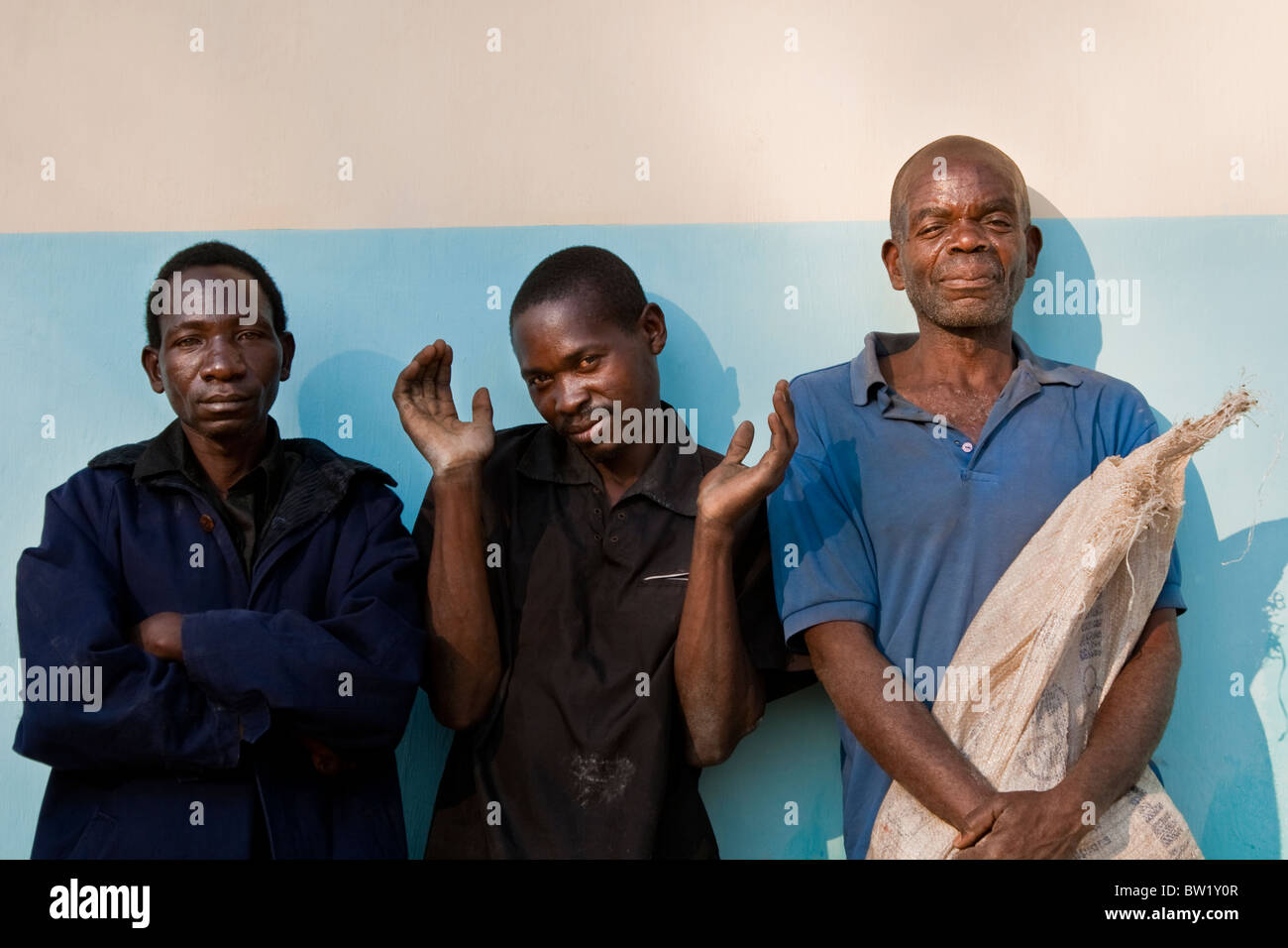 Local men pose for the camera in rural Zambia Stock Photo - Alamy