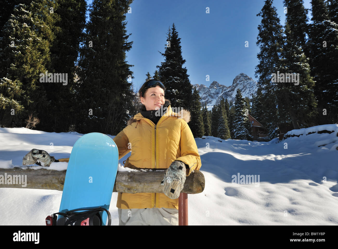Snowboarder girl relaxing Stock Photo - Alamy