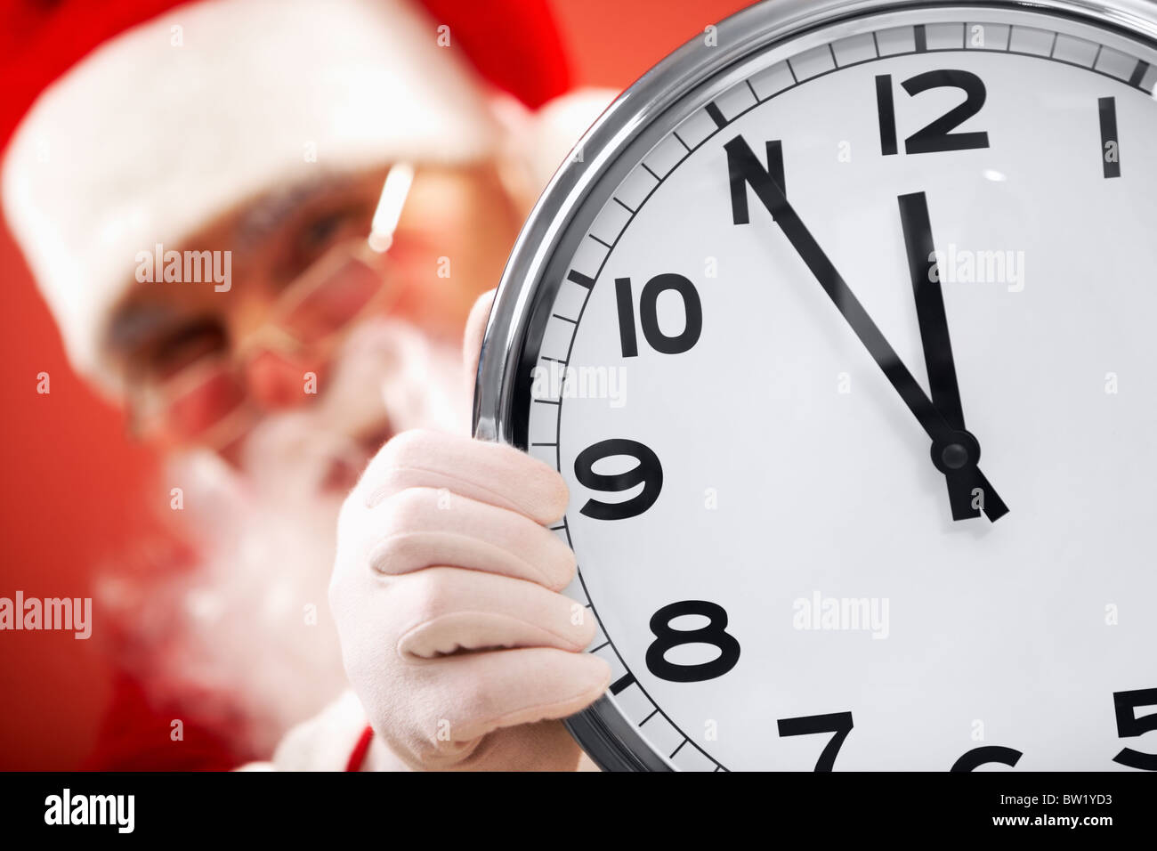 Photo of clock showing five minutes to midnight with Santa on ...
