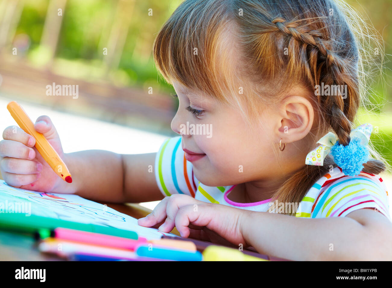 Portrait of cute girl interested in drawing with highlighters Stock ...