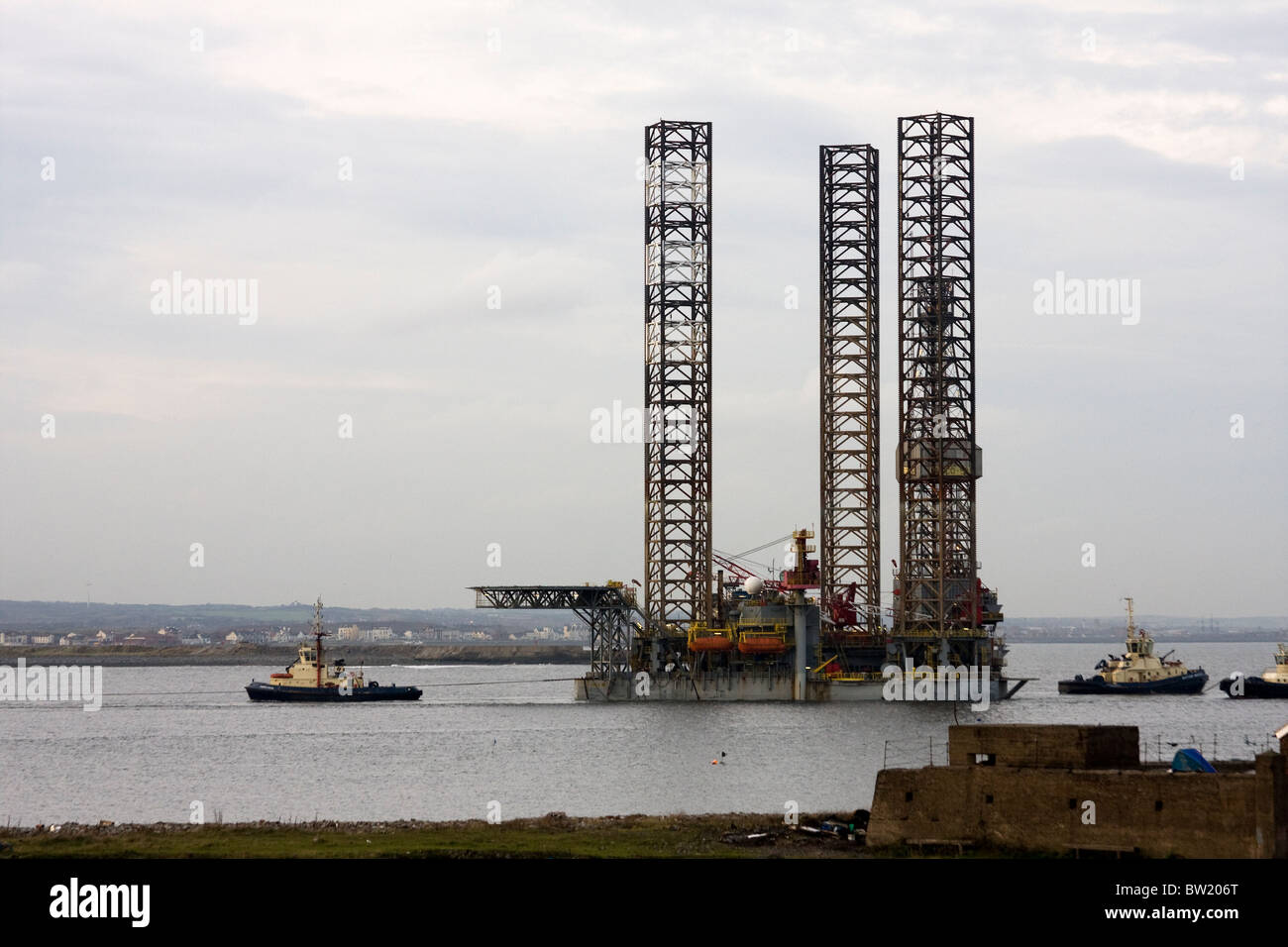 North sea drilling rig being towed by tugs into Teesport at Redcar for ...