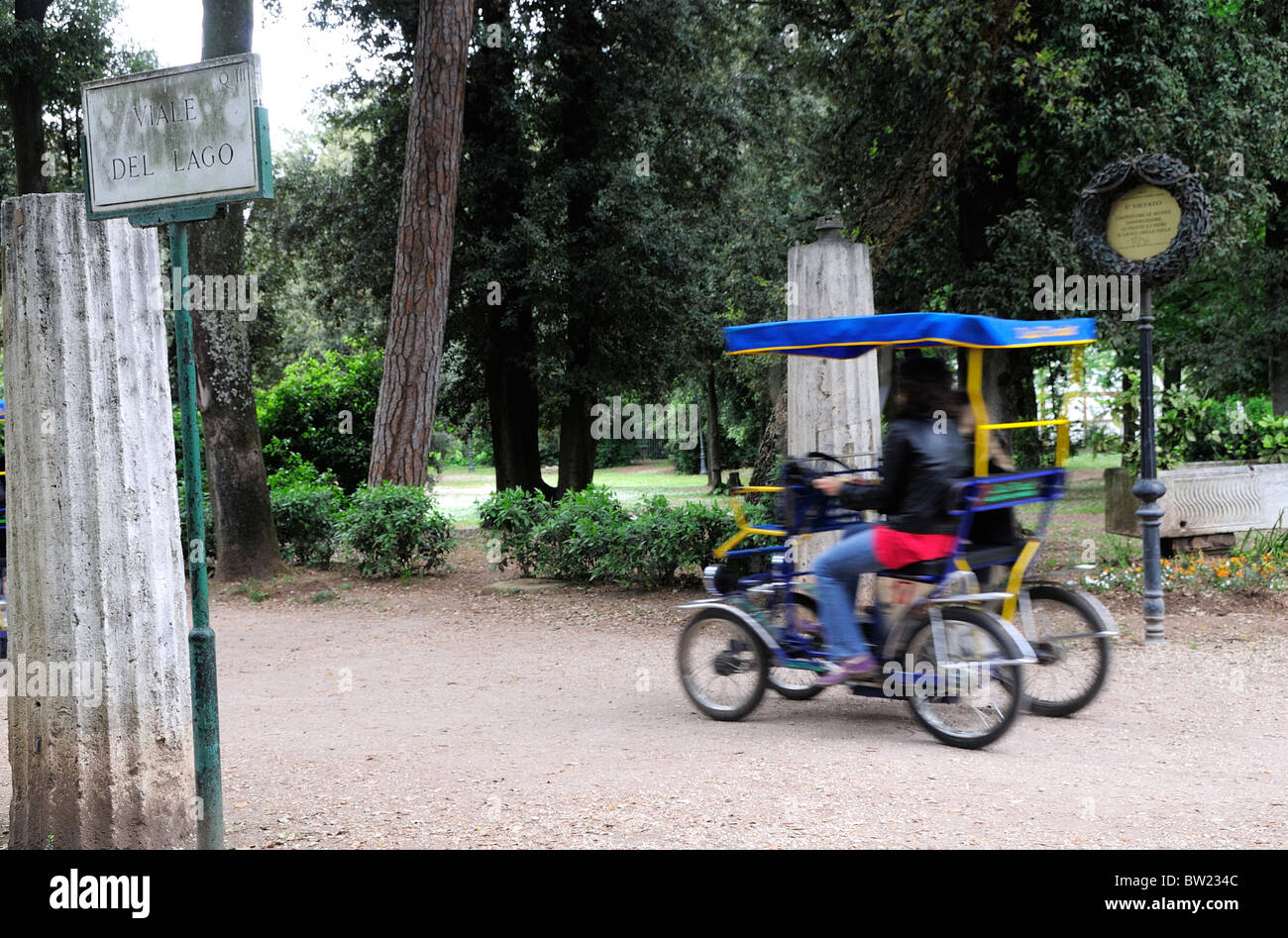Risciò bike (multi seated) in the park, Villa Borghese Stock Photo - Alamy