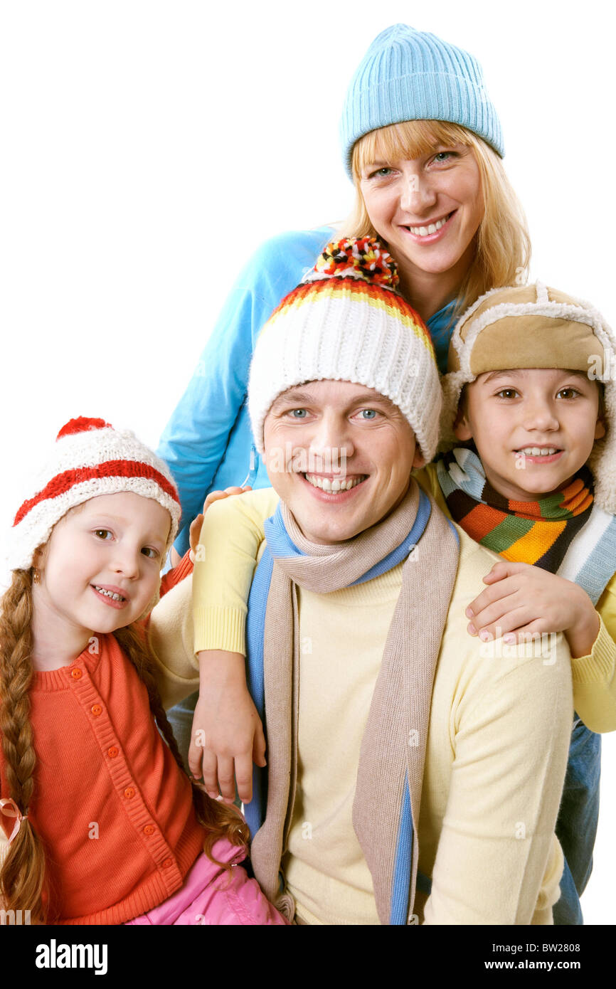 A happy family in winter clothing over white background Stock Photo - Alamy
