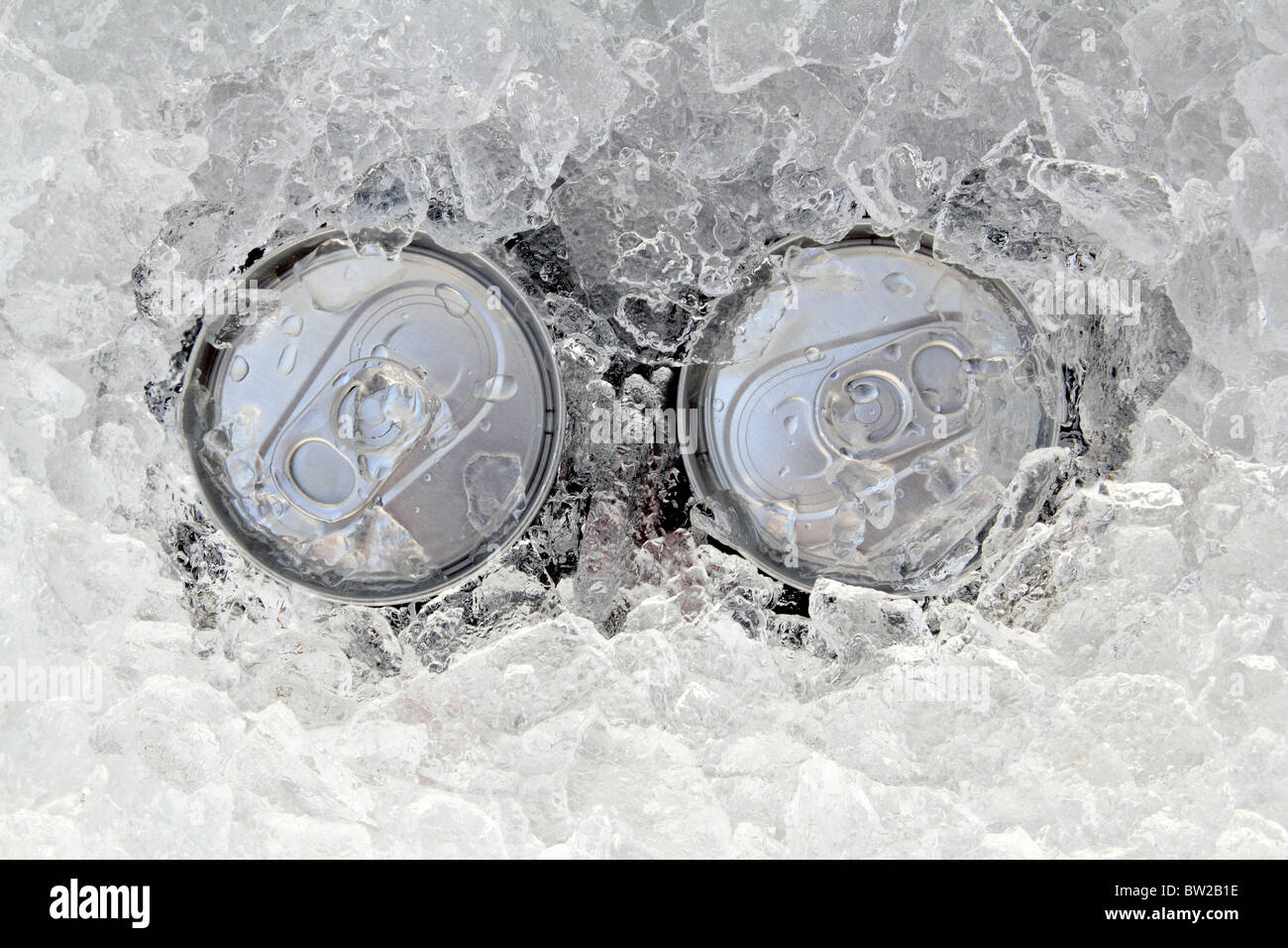 two drink can iced submerged in frost ice closeup Stock Photo - Alamy