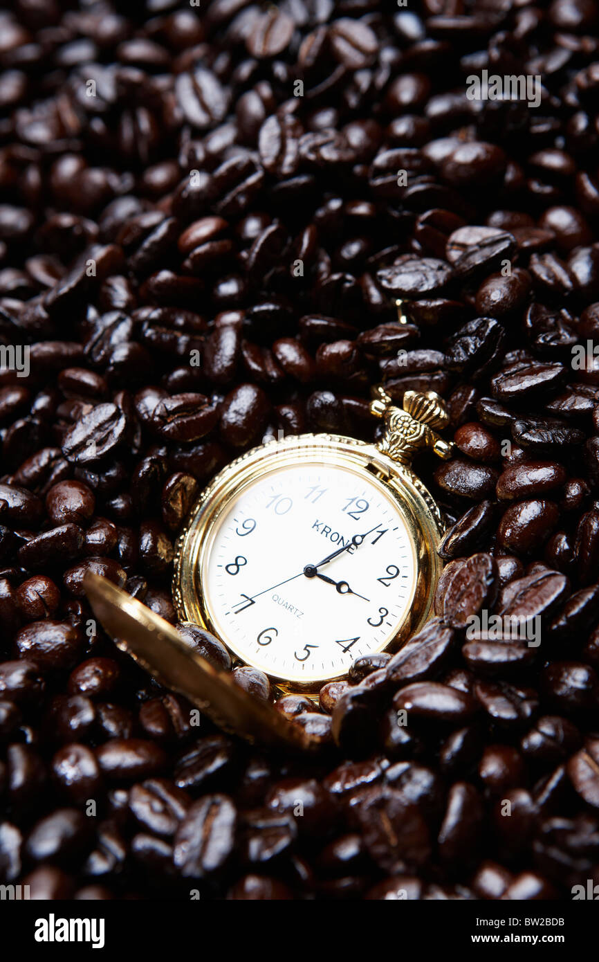 coffee beans and watch Stock Photo - Alamy