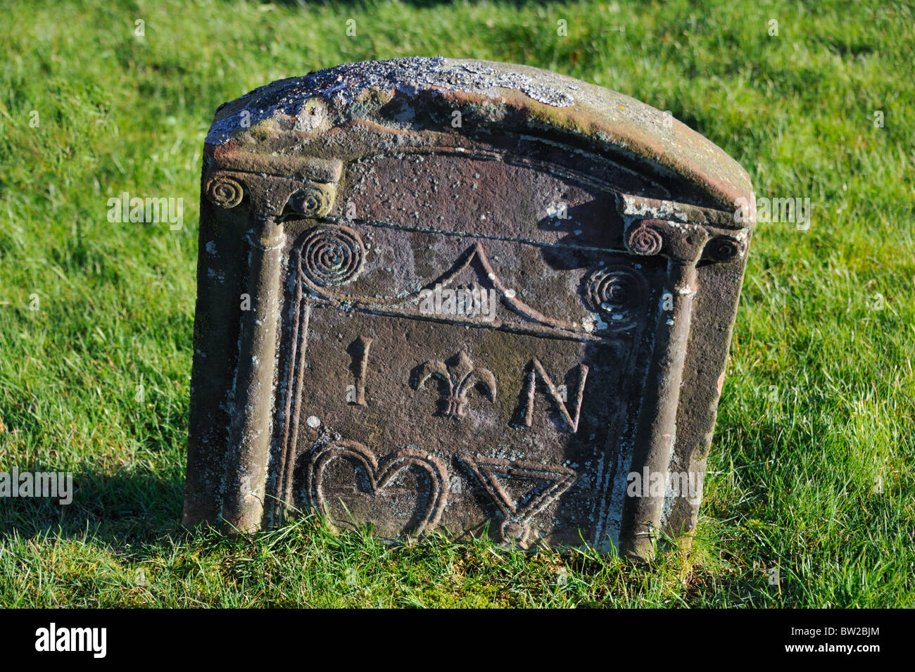 Gravestone with heart and hourglass symbols. Church of Saint Mary ...