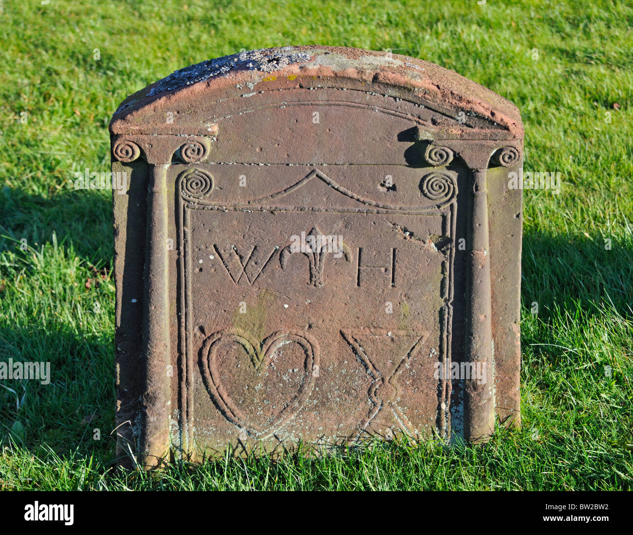 Gravestone with heart and hourglass symbols. Church of Saint Mary ...