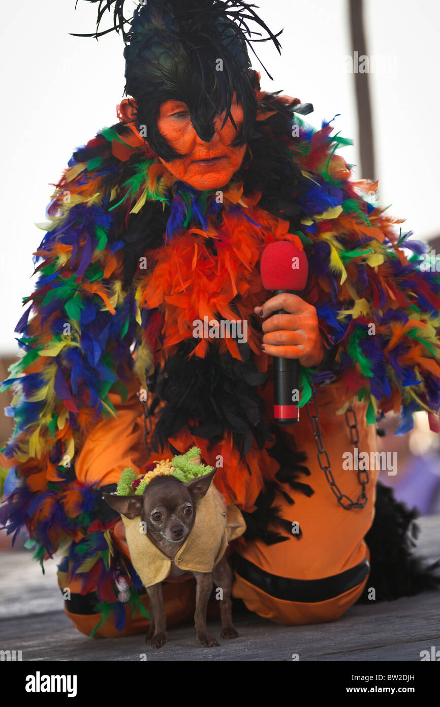 A costumed participant with her dog during the Pet Masquerade at the ...