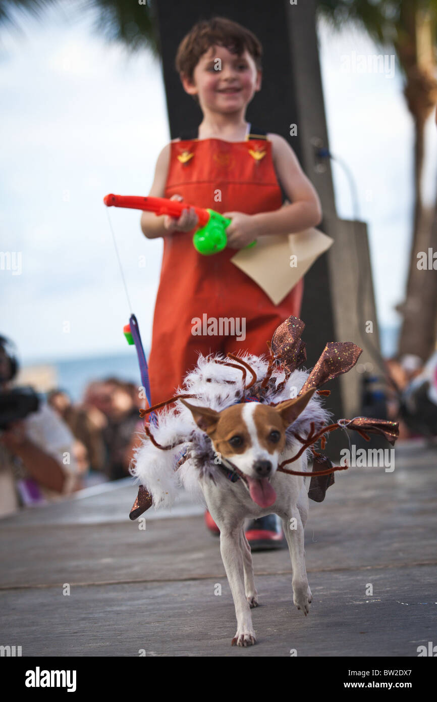 A costumed participant with her dog during the Pet Masquerade at the ...