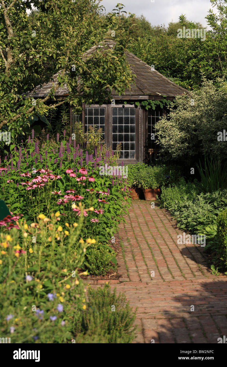 Summerhouse Path and herbaceous border in early August at RHS Gardens Royal Horticultural ...