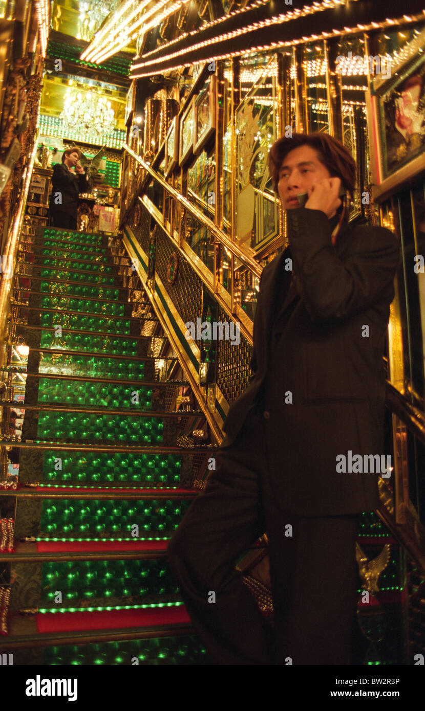 Male hosts call their female clients to invite them to he club, in a ...