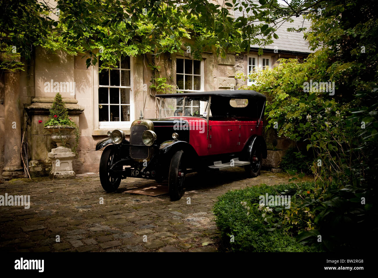Vintage car on display in front of English country house Derbyshire ...