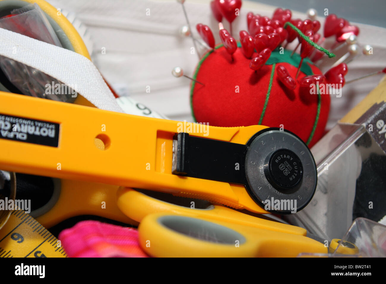 A selection of sewing accessories and haberdashery in a tailors box ...