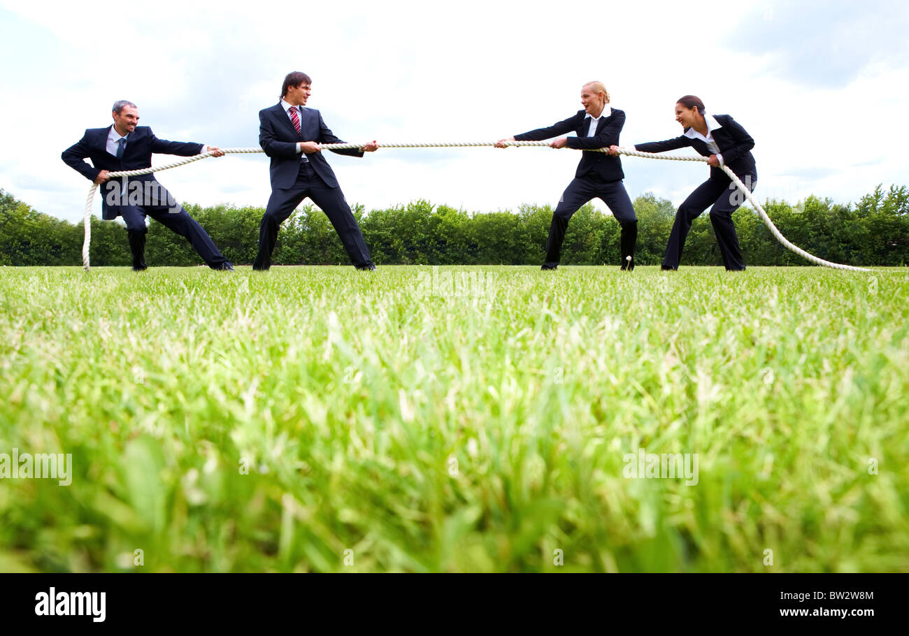 Photo of business people stretching the rope in the stadium Stock Photo ...