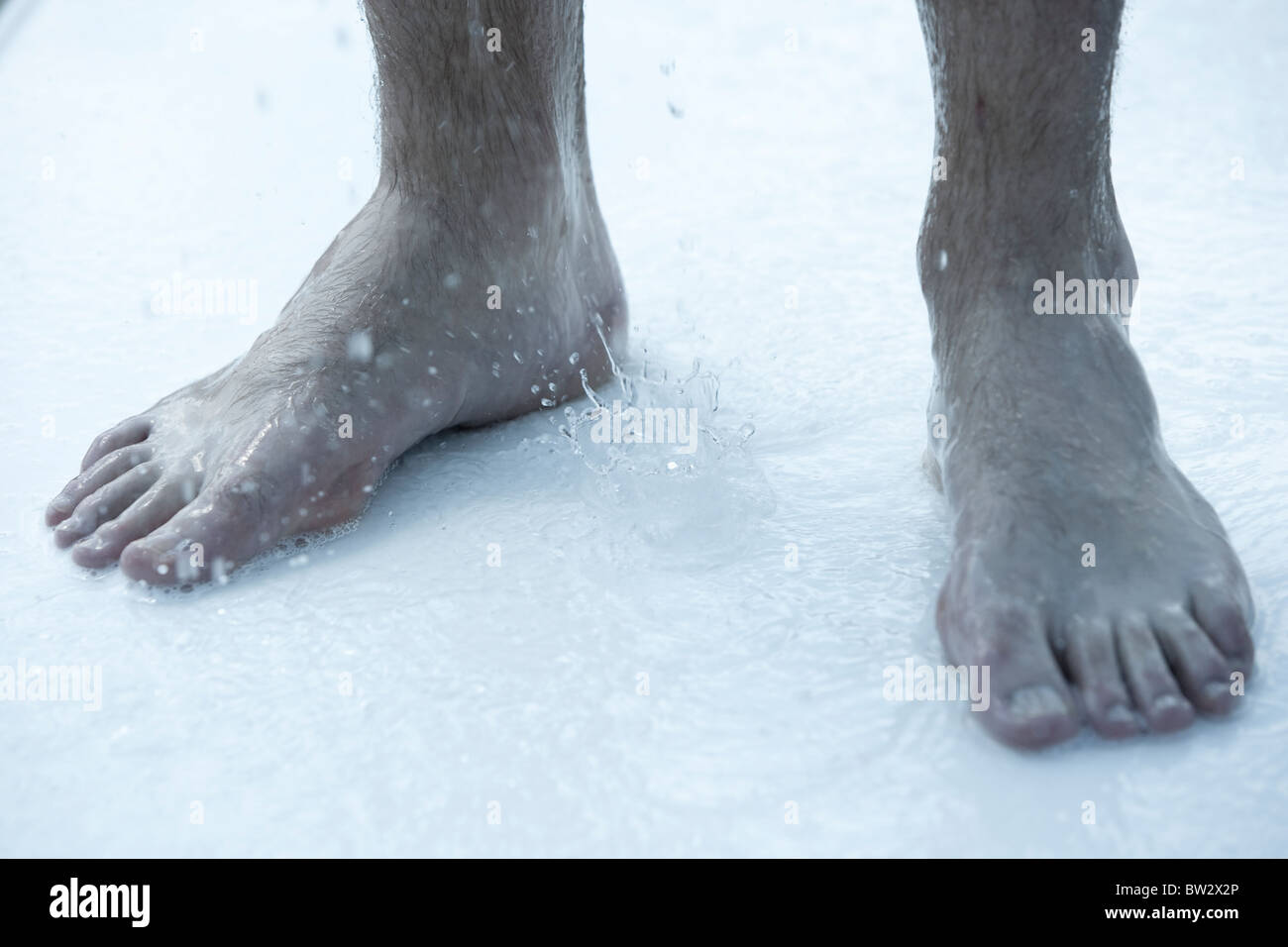 man feet in the shower under the streams of water Stock Photo - Alamy