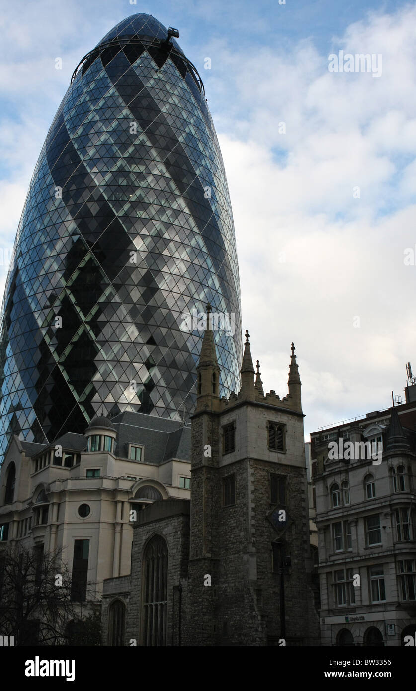 A view of the Gherkin building in London, England, looming over ...