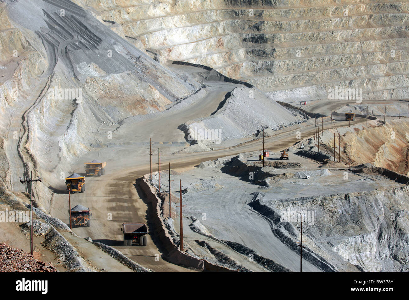 Large mine dump trucks on terrace road of Kennecott Copper Mine in ...