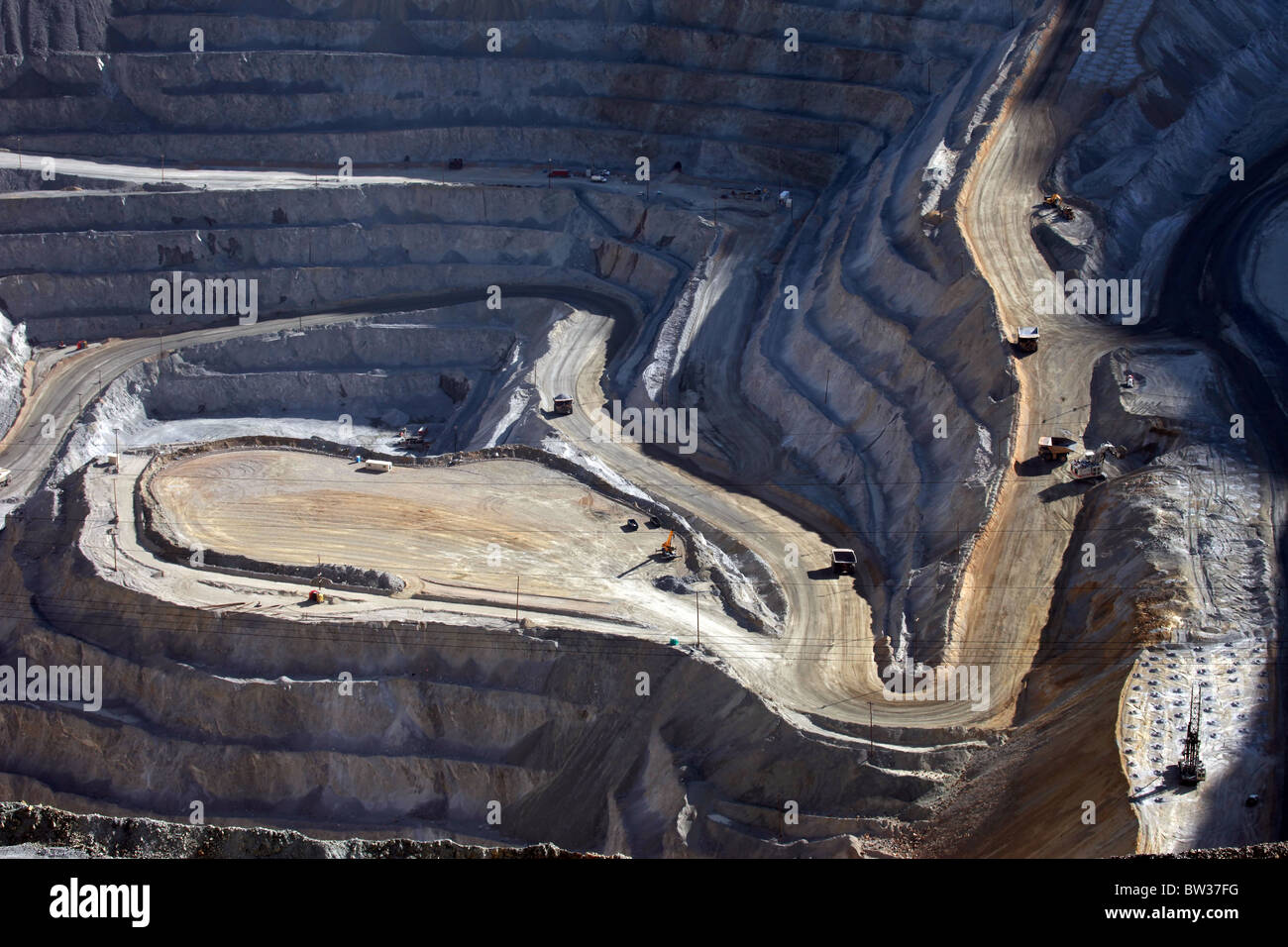 Large mine dump trucks in bottom of Kennecott Copper Mine in central ...
