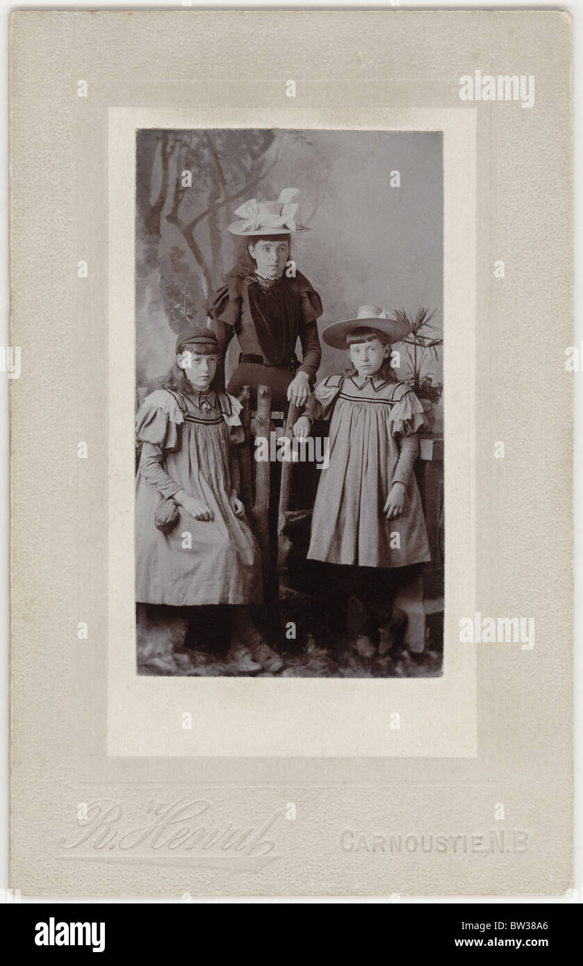 Studio portrait on original card depicting three young Edwardian ...