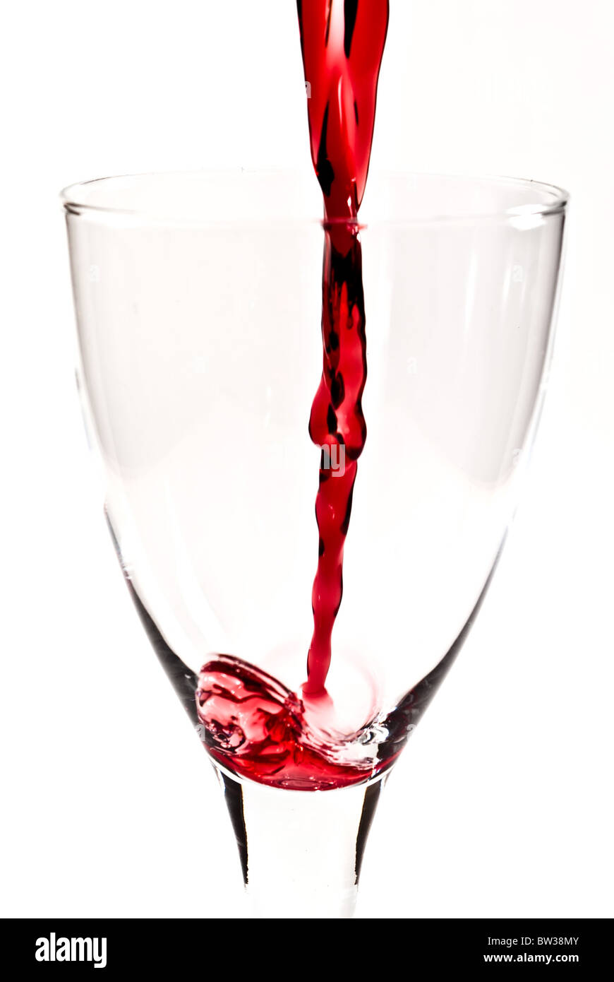 red wine is flowing into the wine glass Stock Photo - Alamy
