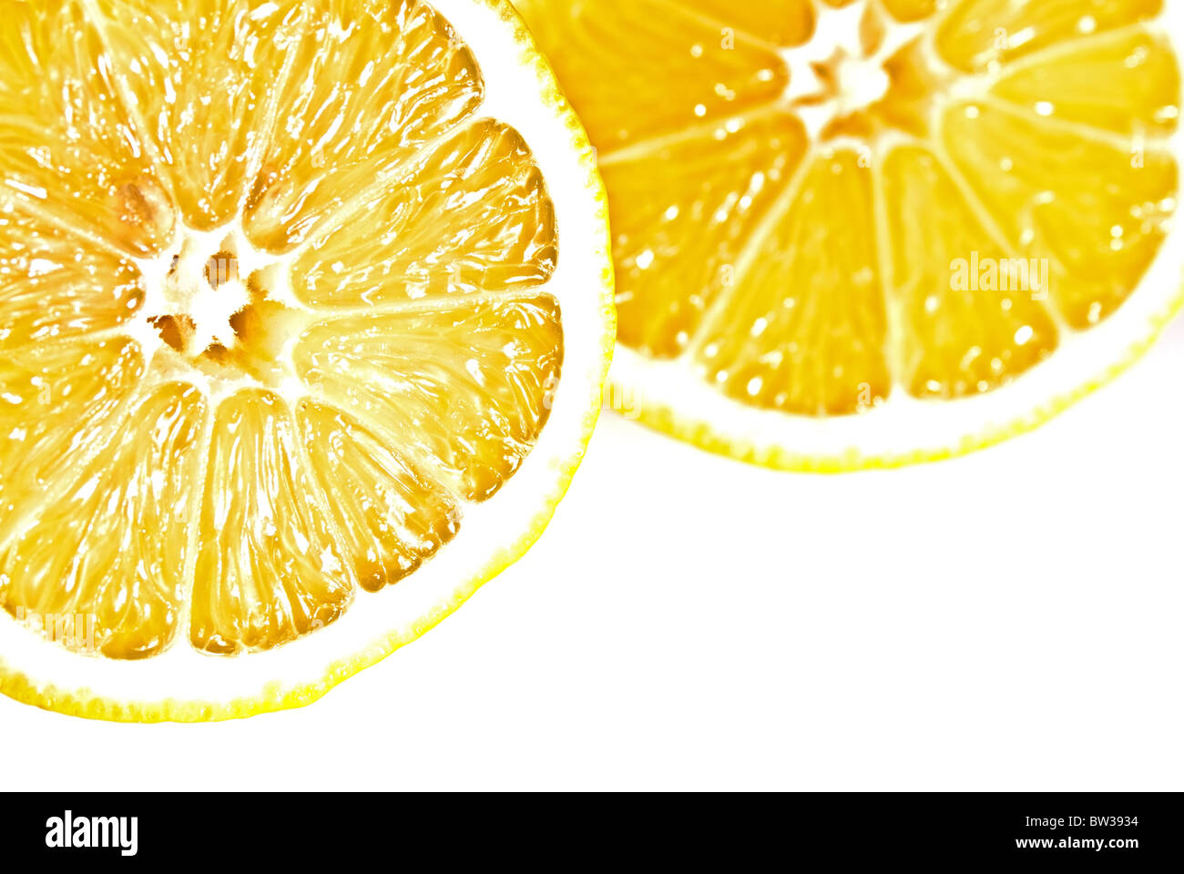 two lemons cross section on white background Stock Photo - Alamy