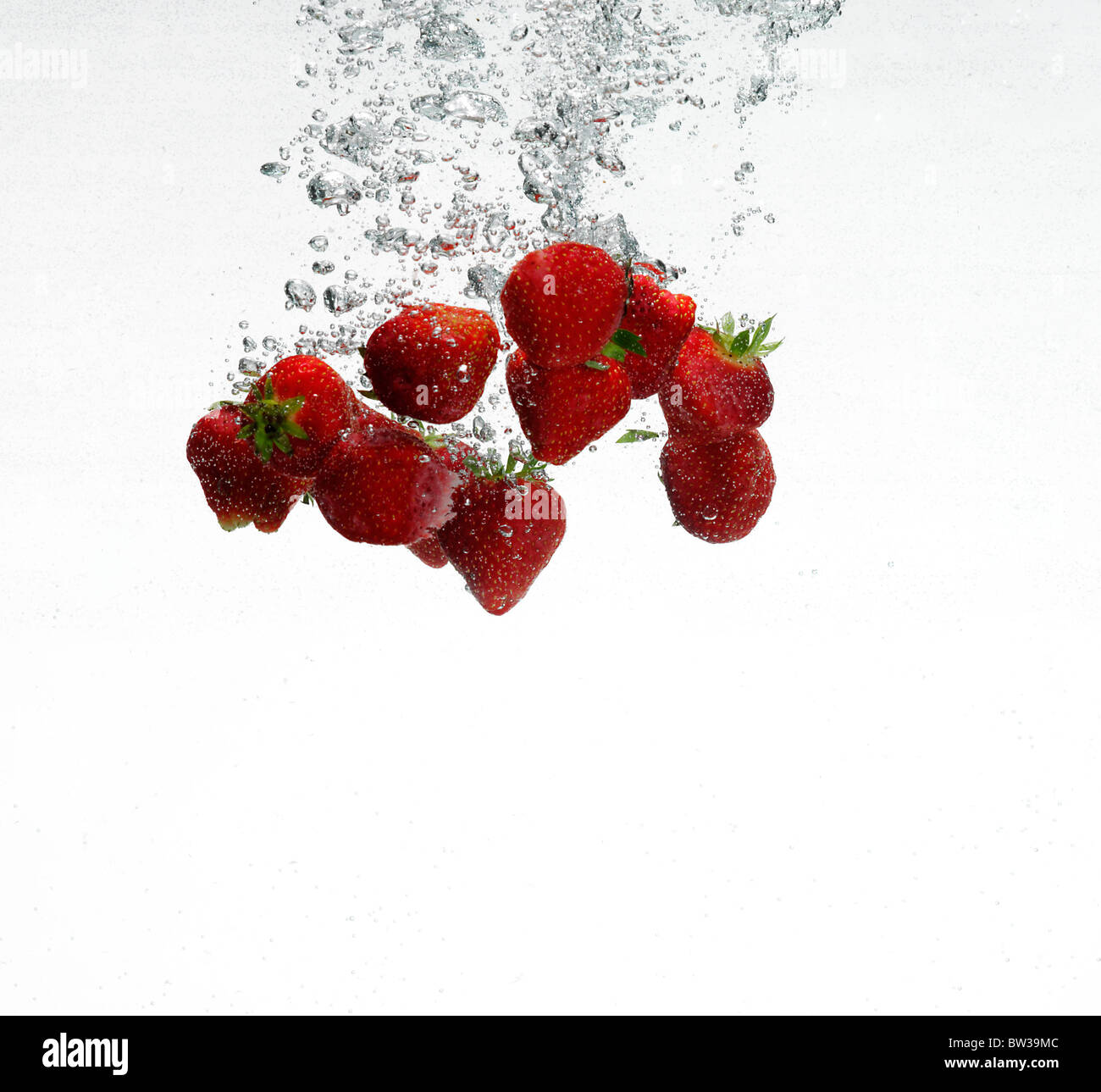 Strawberries in water Stock Photo - Alamy