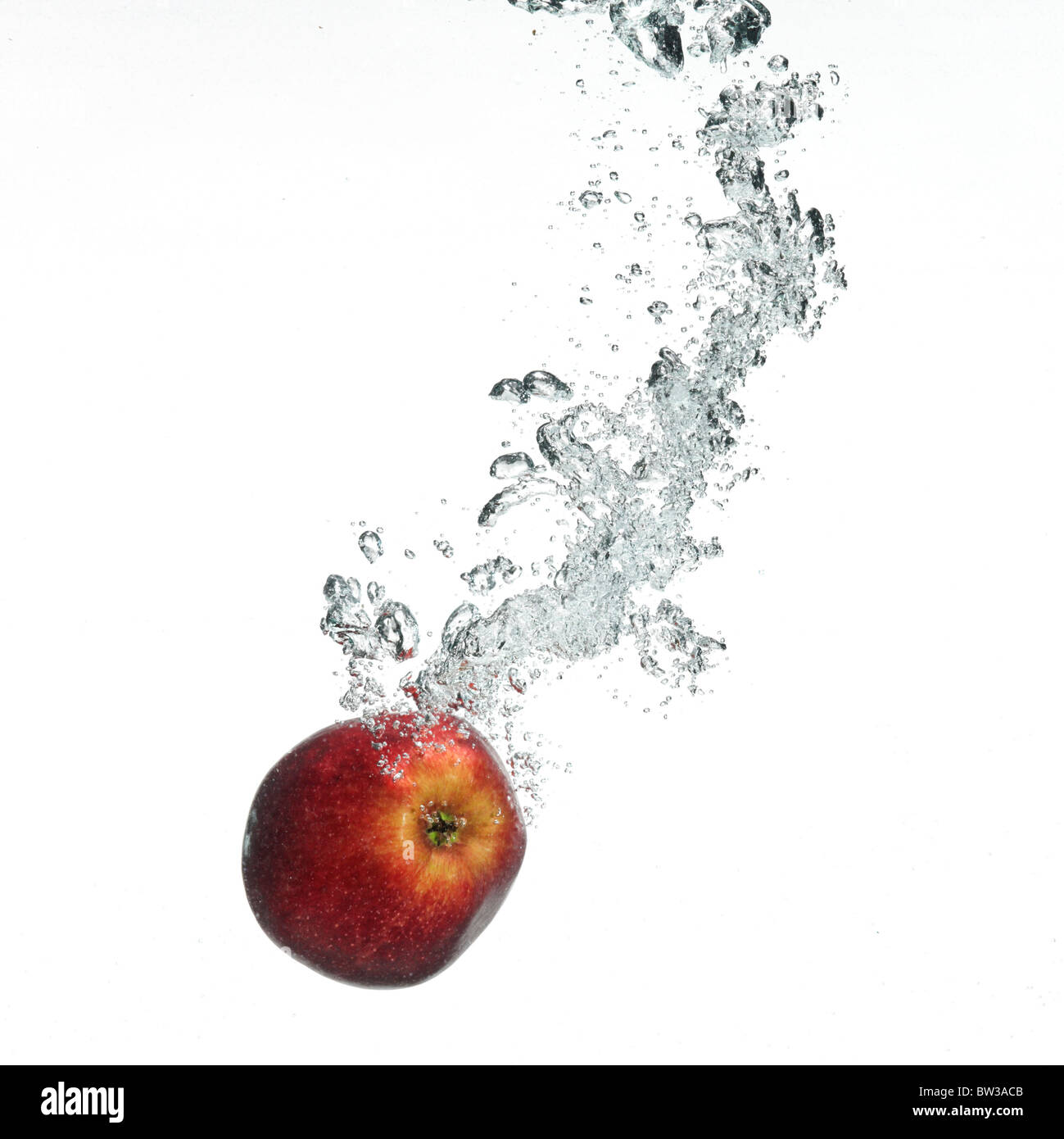 Red apple and water splash isolated on white Stock Photo - Alamy