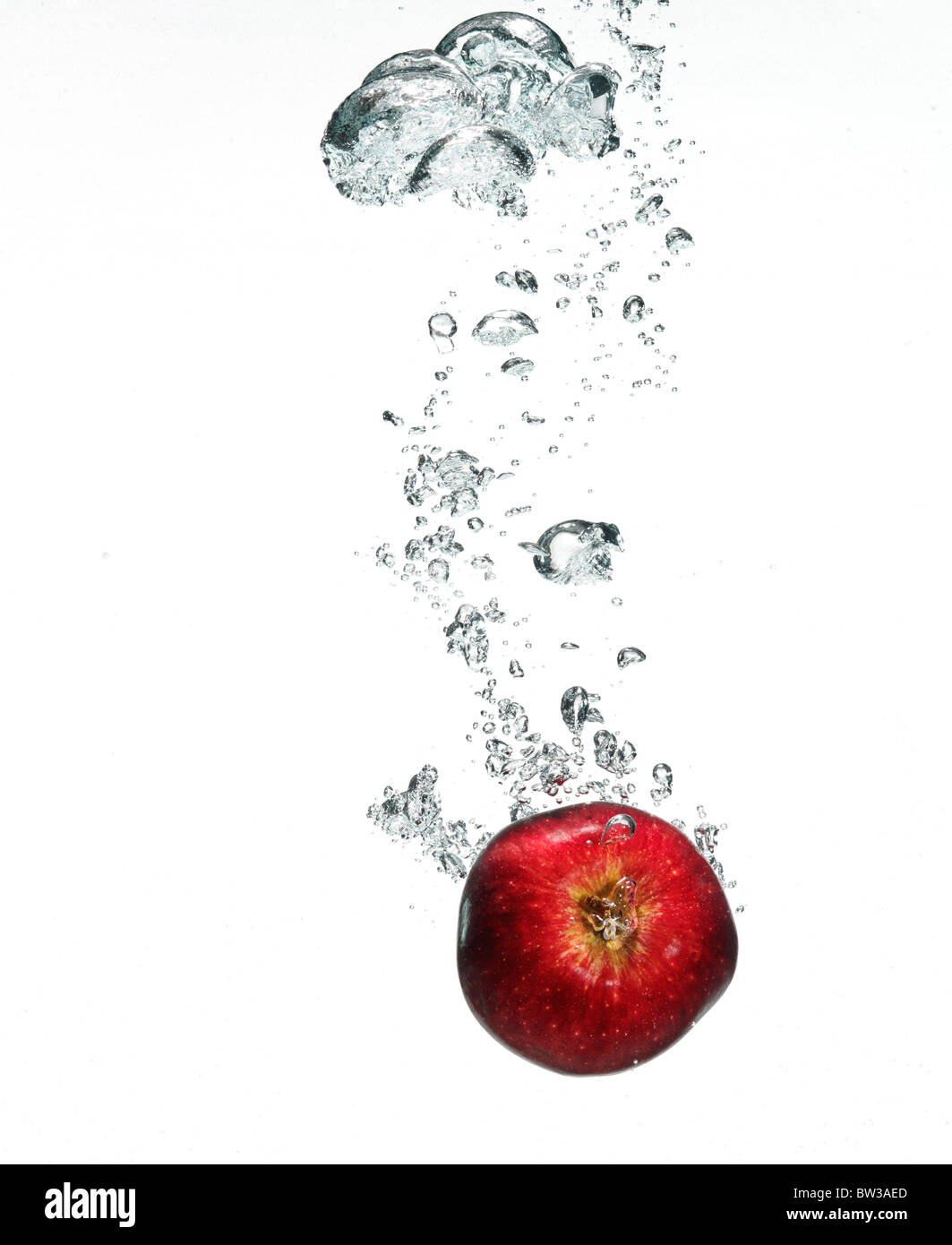 Red apple and water splash isolated on white Stock Photo - Alamy