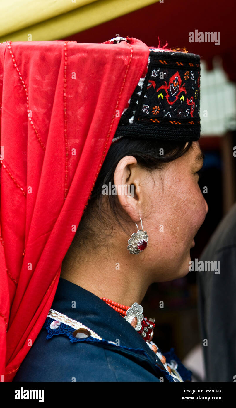 A Tajik woman wearing a traditional hat Stock Photo - Alamy