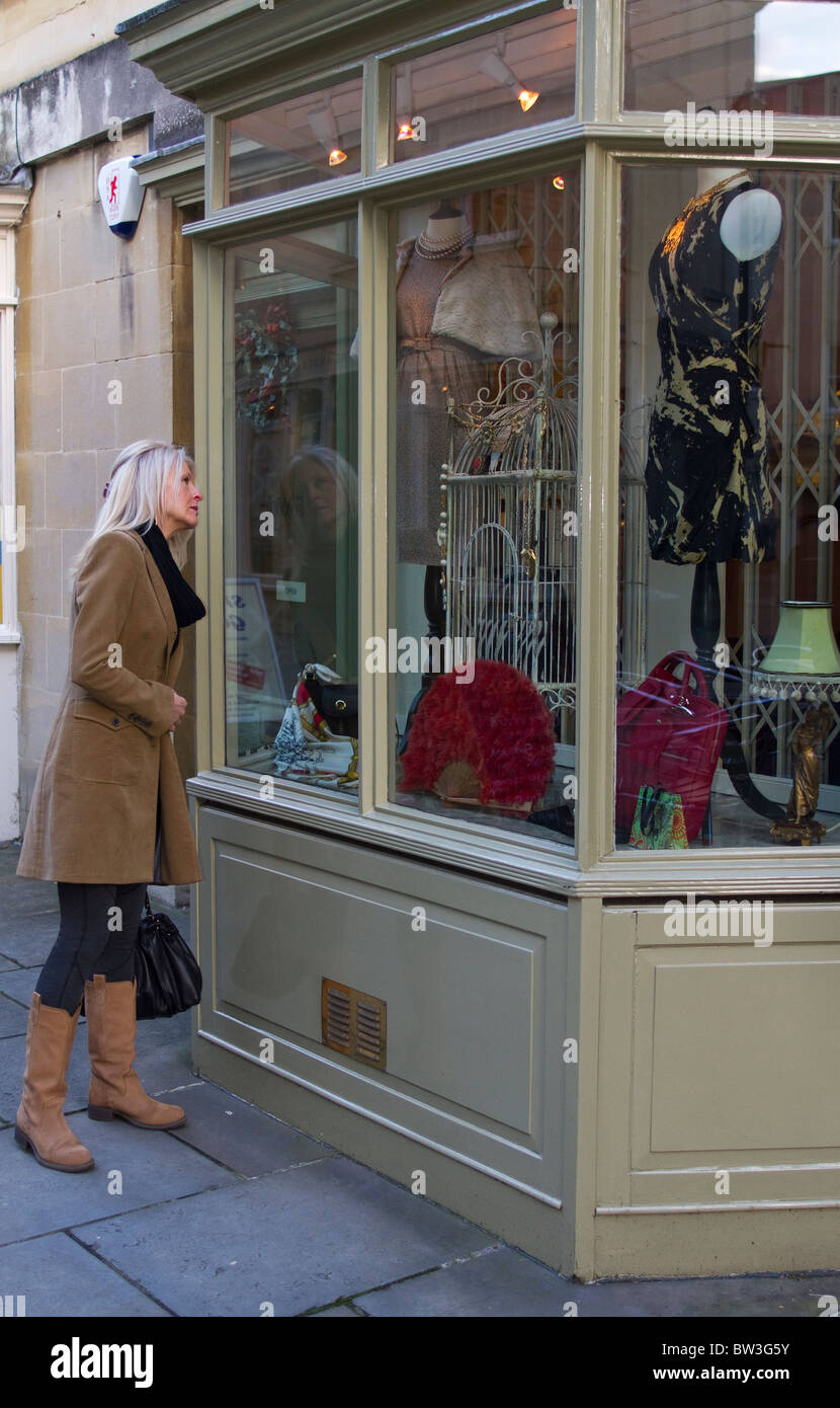 Single female goes window shopping Stock Photo - Alamy