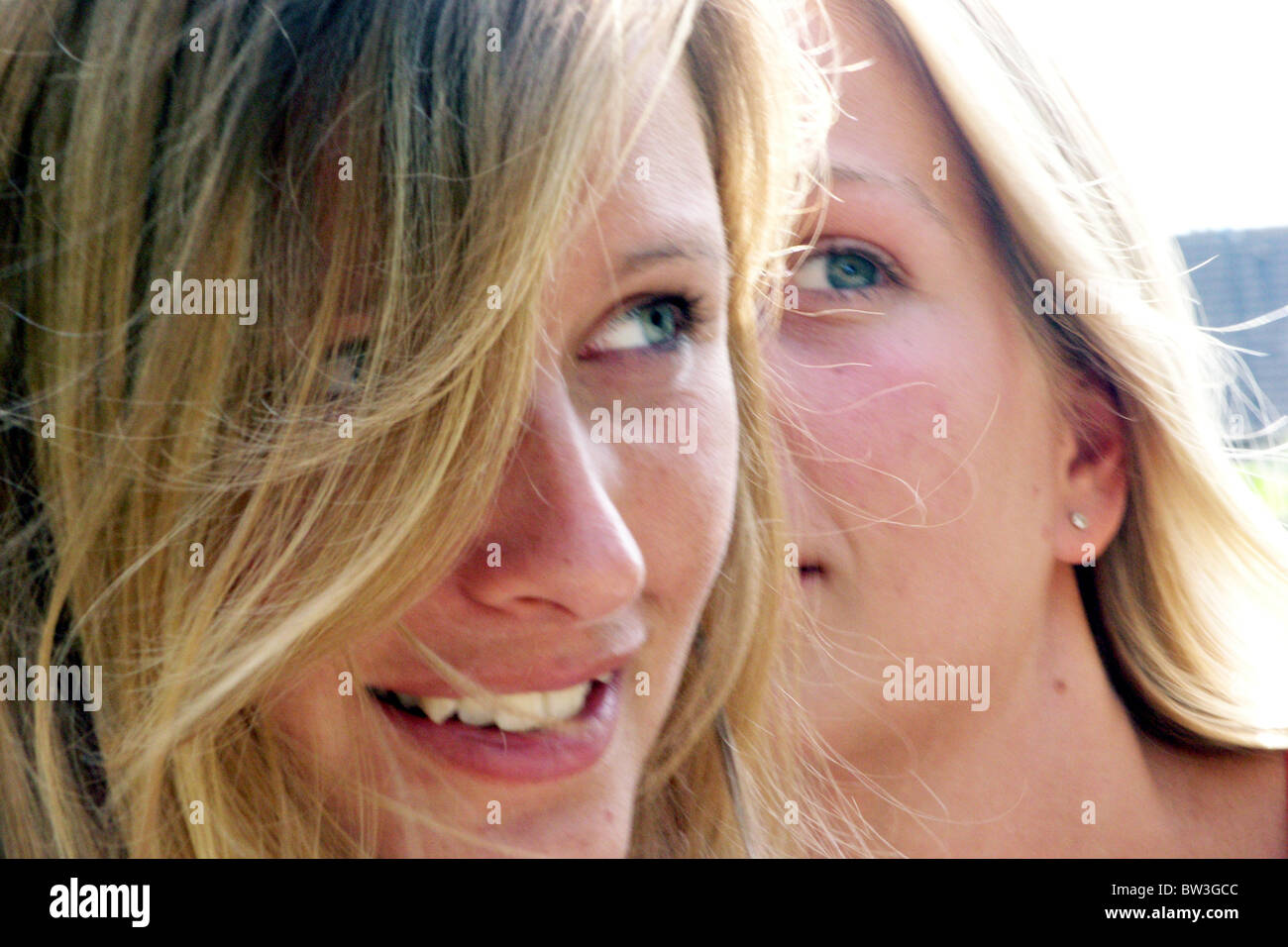 Adults whispering hi-res stock photography and images - Alamy