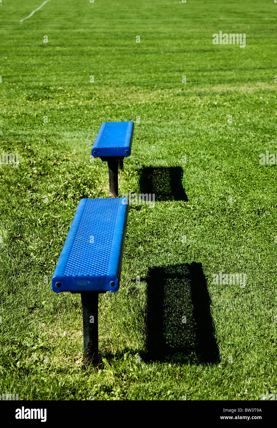 2 Blue benches at soccer field, British Columbia Stock Photo - Alamy