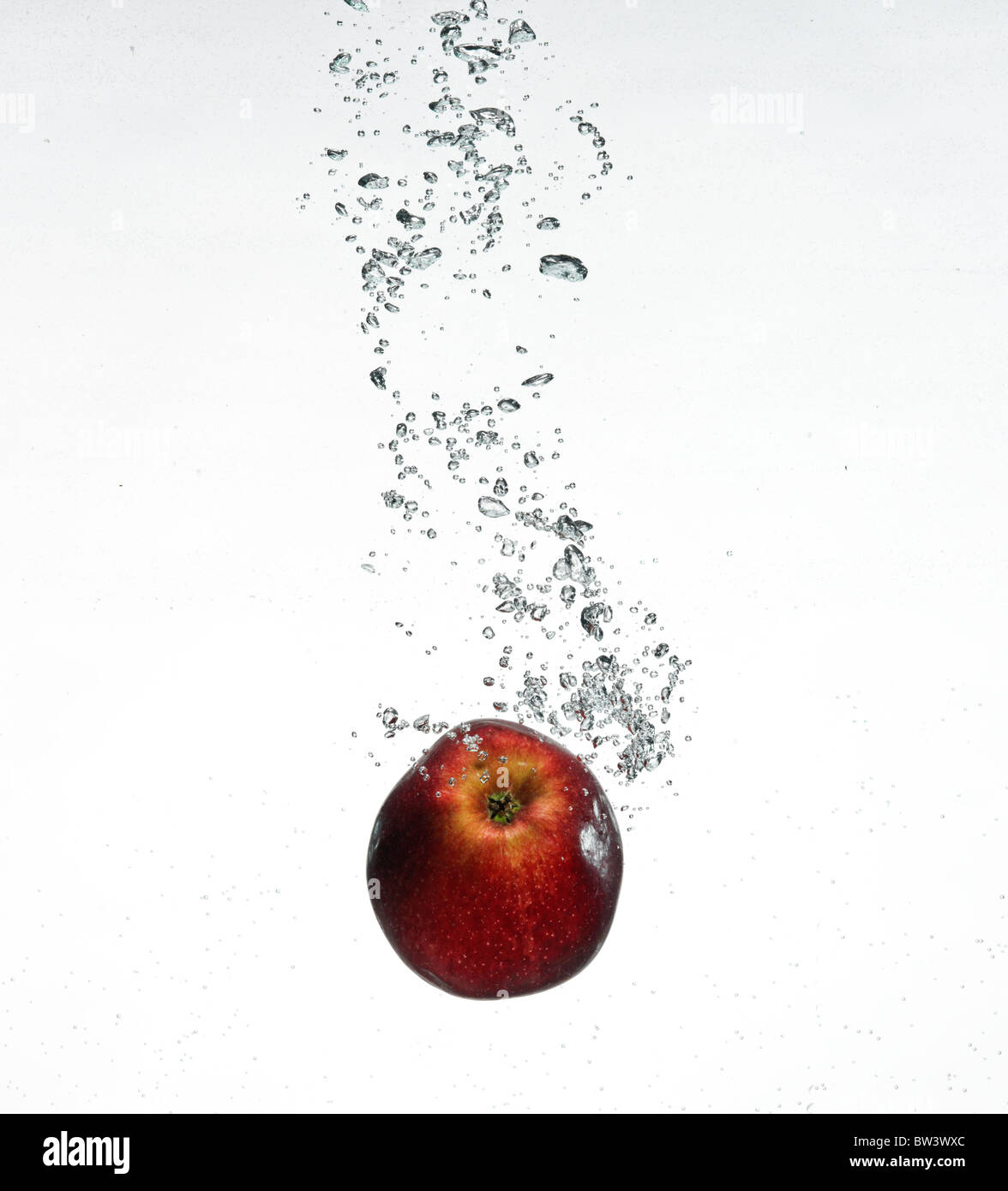 Red apple and water splash isolated on white Stock Photo - Alamy