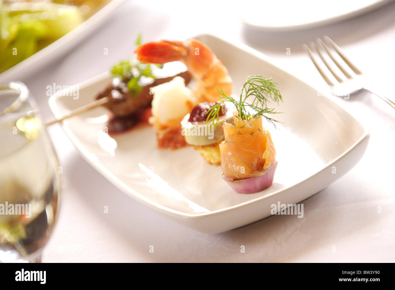 Shrimp and seafood plate, dinner table setting Stock Photo - Alamy