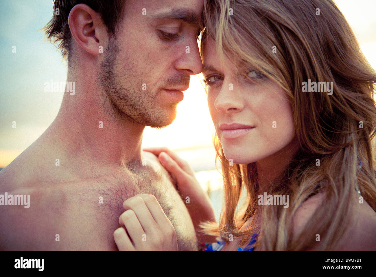 Young couple embrace on beach Stock Photo - Alamy Young couple embrace on beach Stock Photo - Alamy