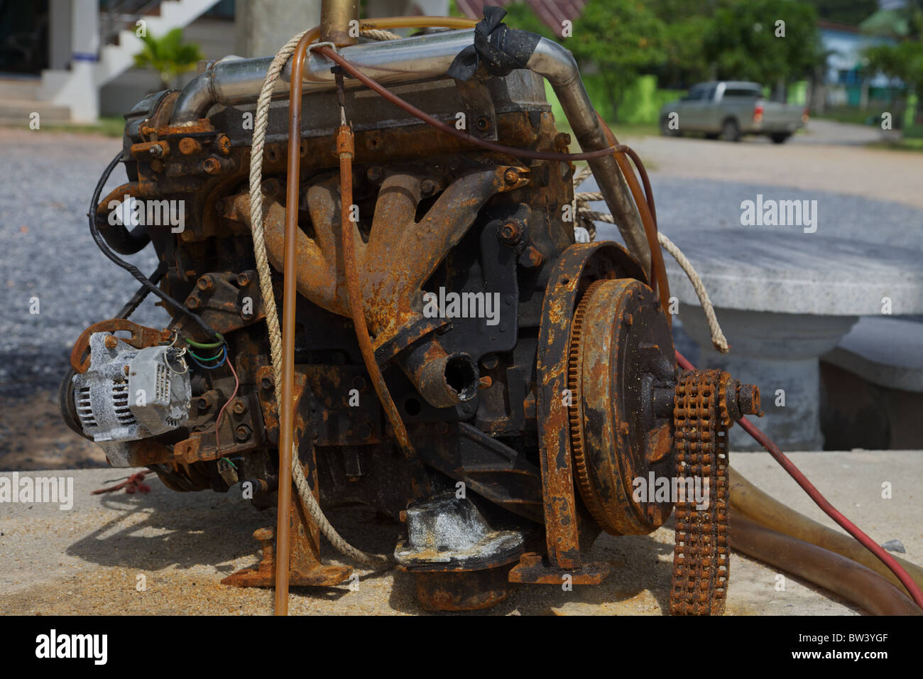 An old rusty engine from a long tail boat in Thailand Stock Photo - Alamy