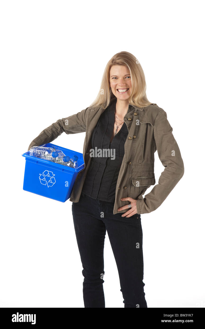 Woman carrying full recycling bin, white background Stock Photo - Alamy