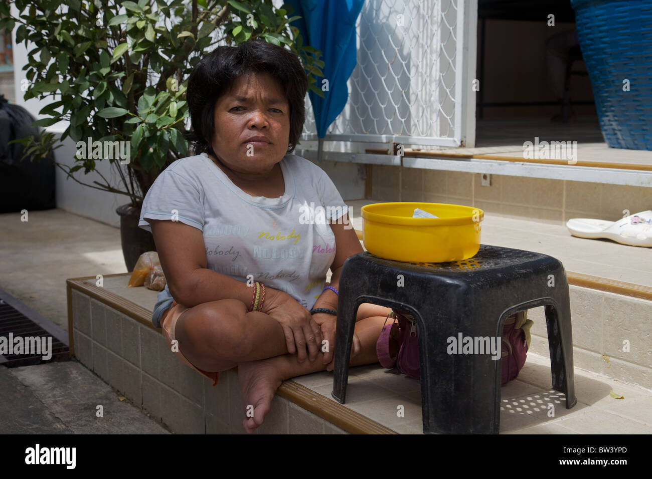 A disabled lady begging at a temple in Phuket, Thailand Stock Photo - Alamy
