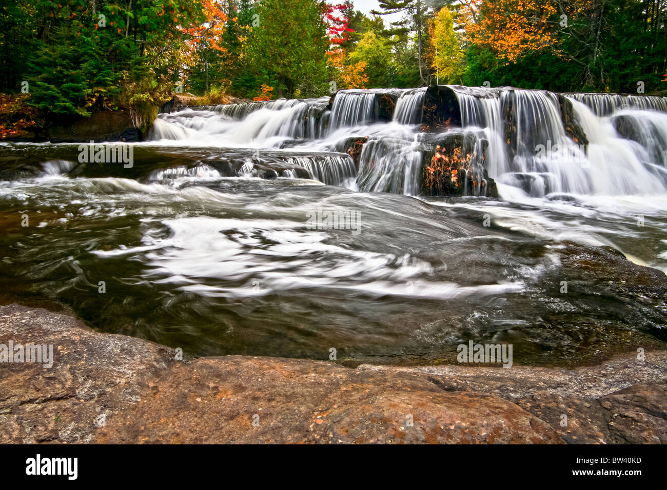 The upper part of Bond Falls shows a cascading mini falls surrounded by ...
