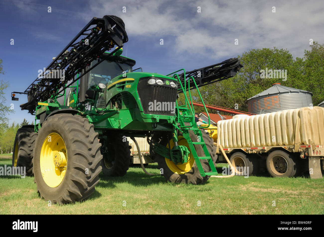 Sprayer loading up to prepare the fields for seeding near Mundare ...