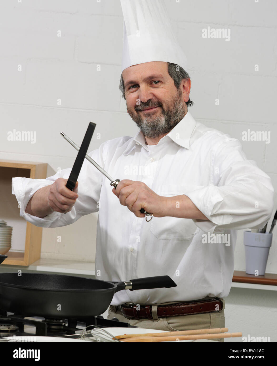 Cook in a kitchen, making a delicious dish Stock Photo - Alamy Cook in a kitchen, making a delicious dish Stock Photo - Alamy
