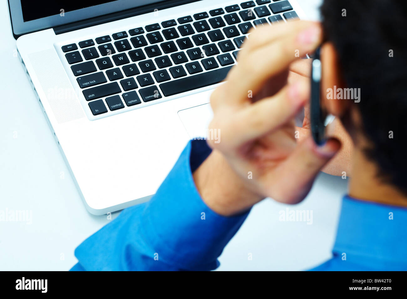 Photo of open laptop with calling businessman near by Stock Photo - Alamy