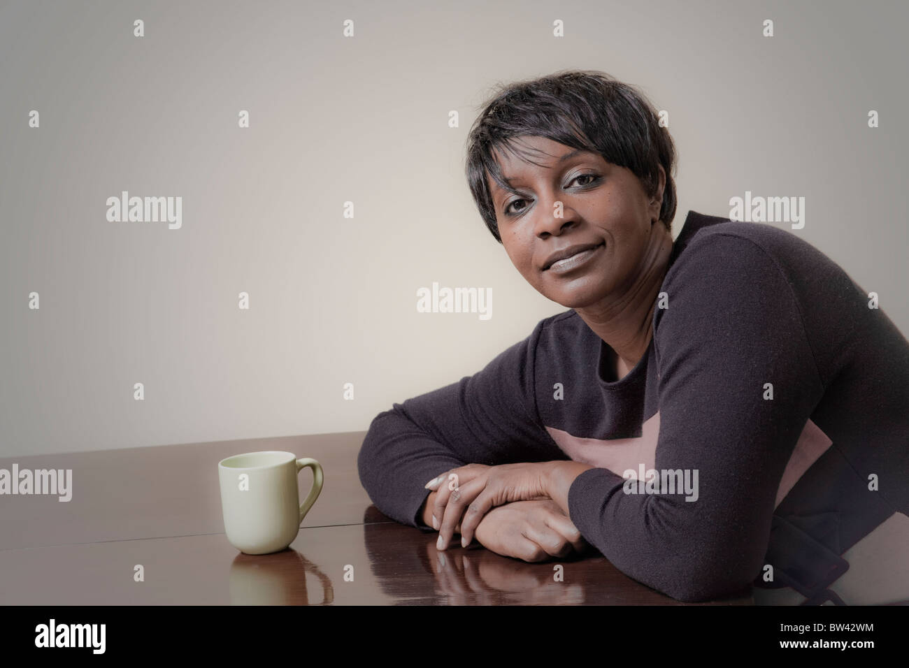 Black woman, age 44, with a cup of coffee Stock Photo - Alamy